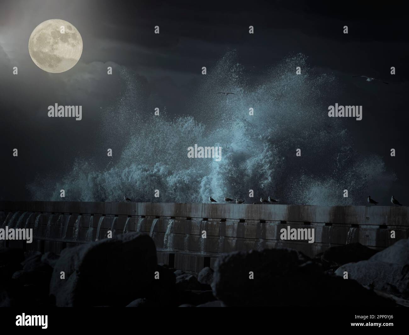 Stormy wave splash in a full moon night Stock Photo - Alamy