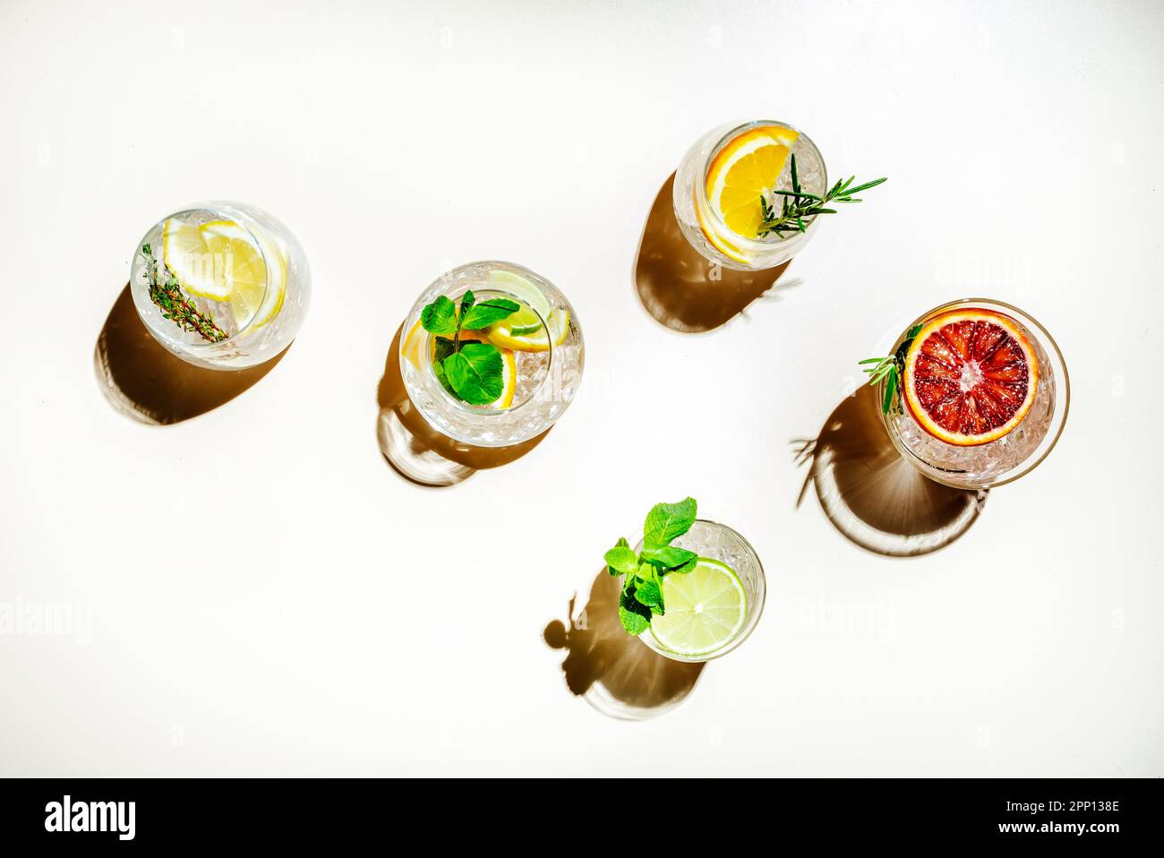 Gin tonic citrus and herb cocktails set, top view. Assortment of summer ...