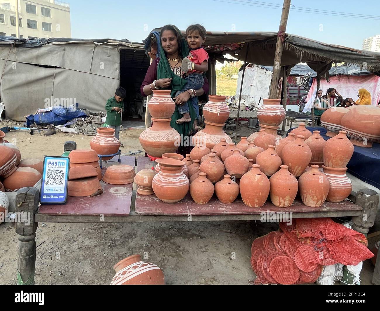 Icha Lohar and her family sell claypots in the roadsides of Gurugram ...