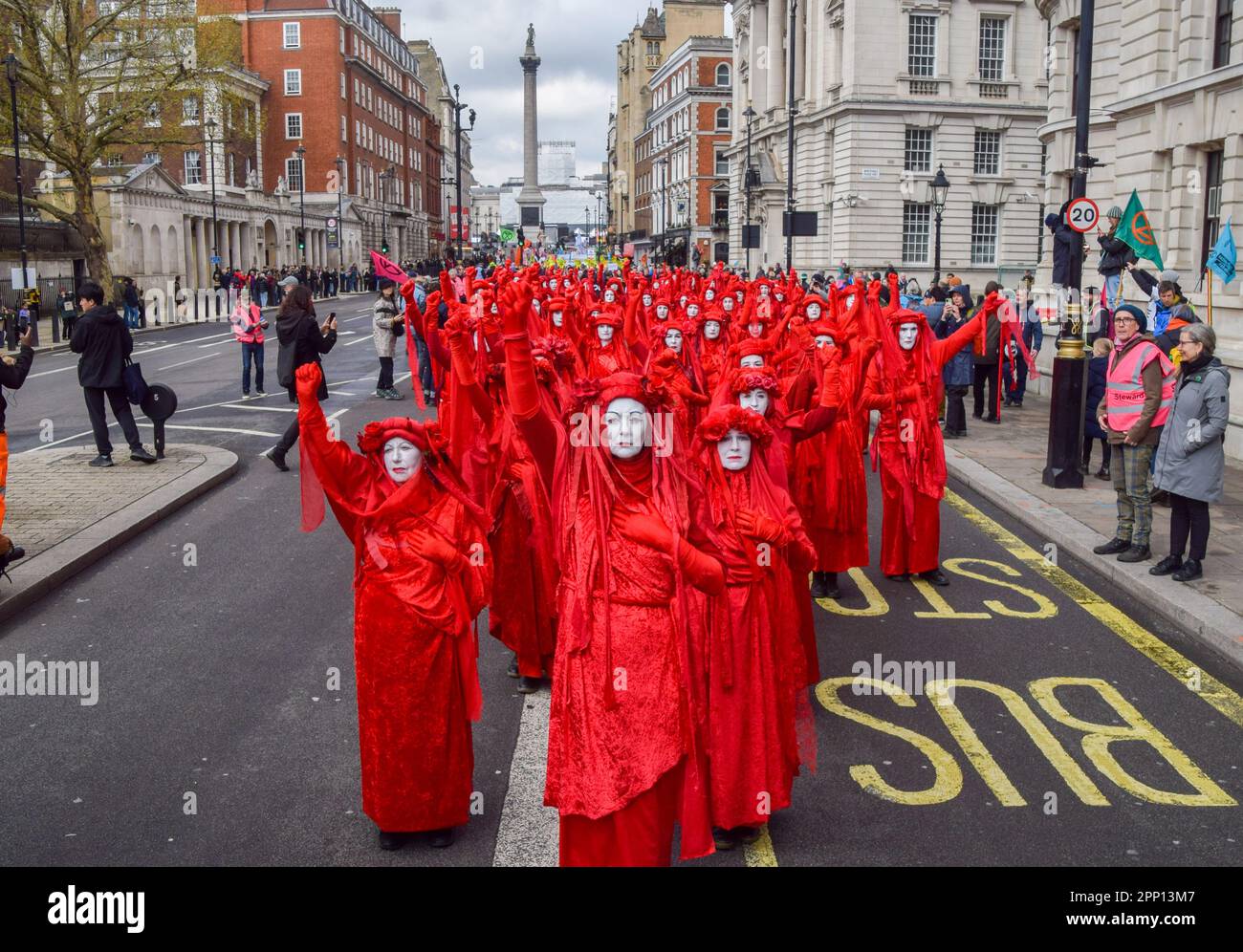 London, UK. 21st April 2023. Red Rebels pass through Whitehall as ...