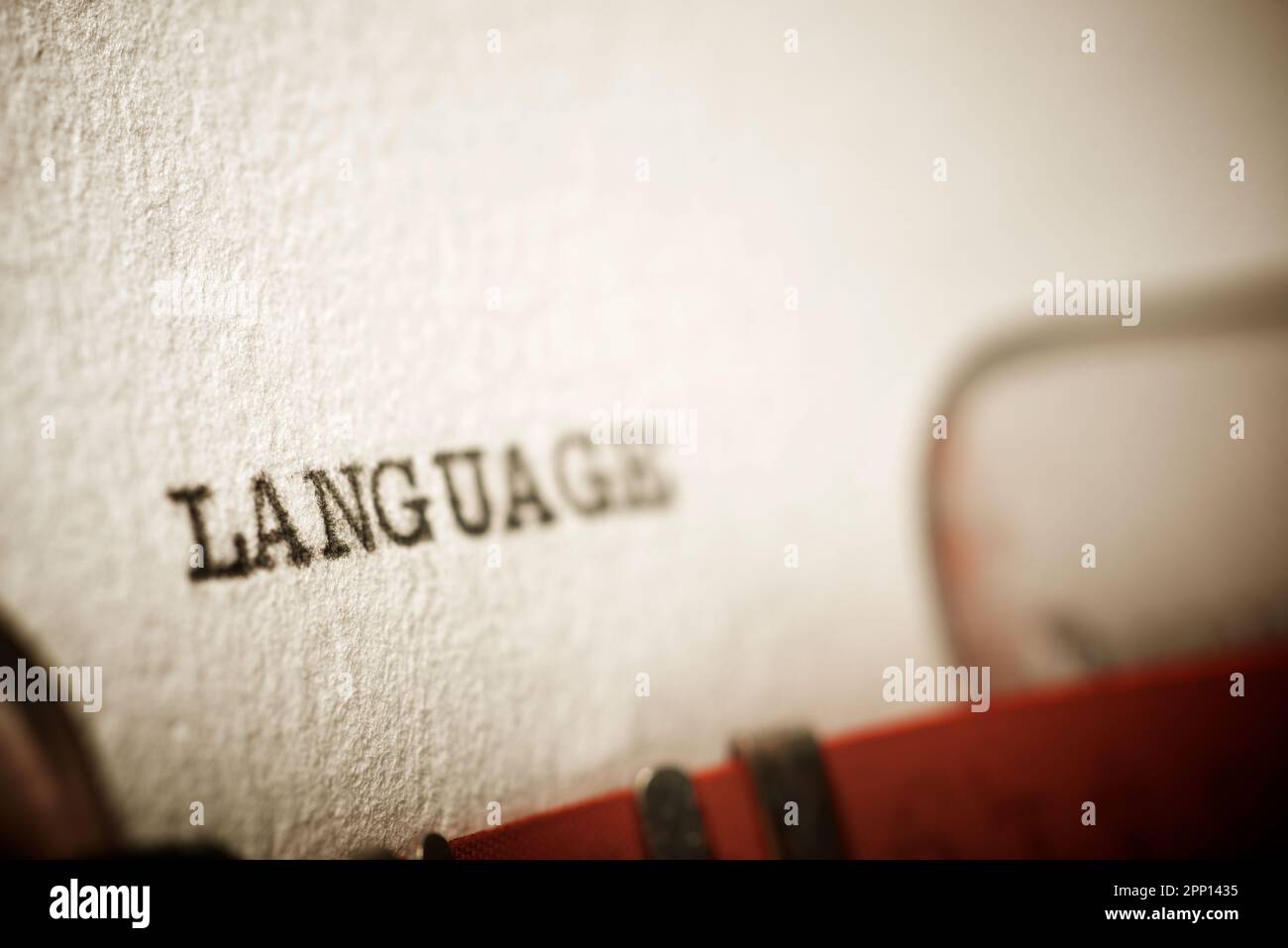 Language word written with a typewriter Stock Photo - Alamy