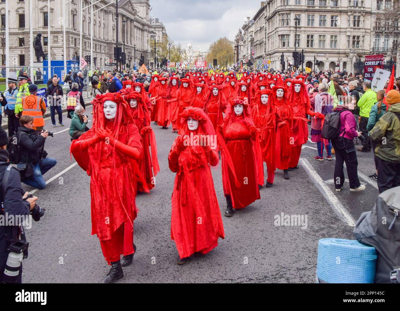 London, UK. 21st April 2023. Red Rebels pass through Parliament Square ...