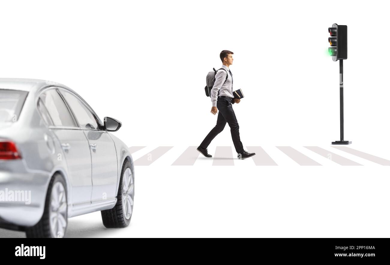 Male student walking at a pedestrian zebra crossing and car waiting at ...