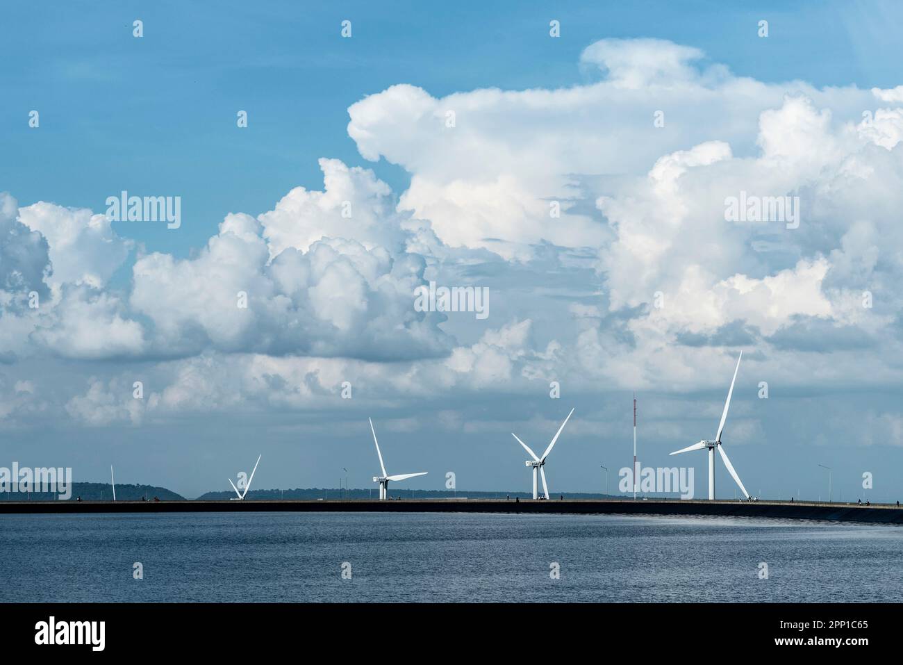 A scenic landscape of wind turbines in a lake against a backdrop of ...