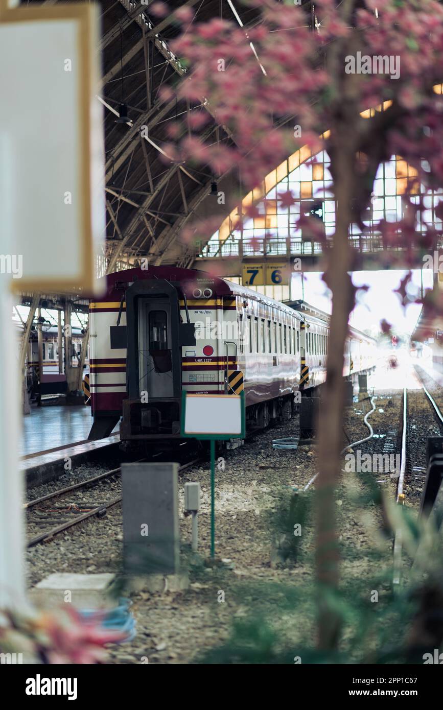 A passenger train arrives at a railway station in Hau Lam Pong, Bangkok ...