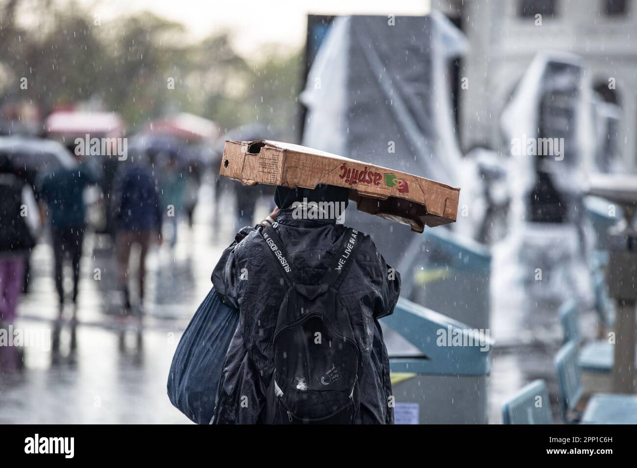 During the heavy rain in Istanbul, a man walking on the Kadikoy dock ...
