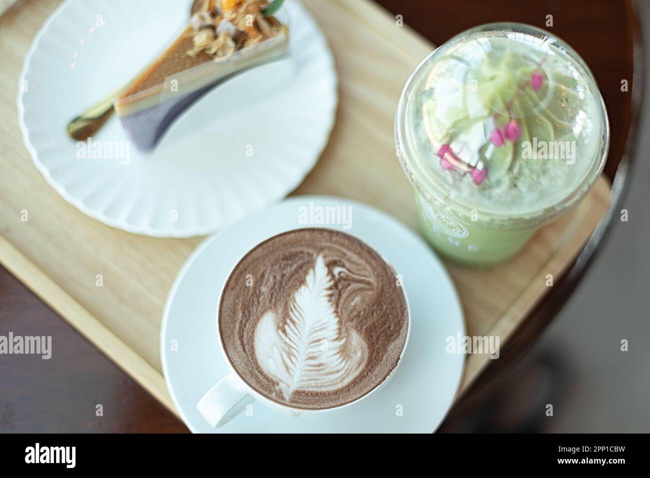 A top view of a white ceramic tray full of freshly prepared cake and ...