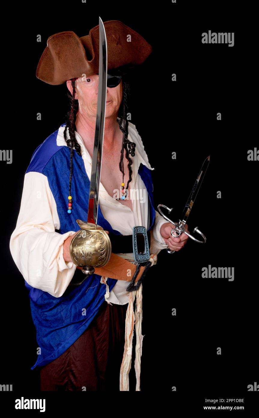 Pirate isolated on black with a cutlass Stock Photo - Alamy