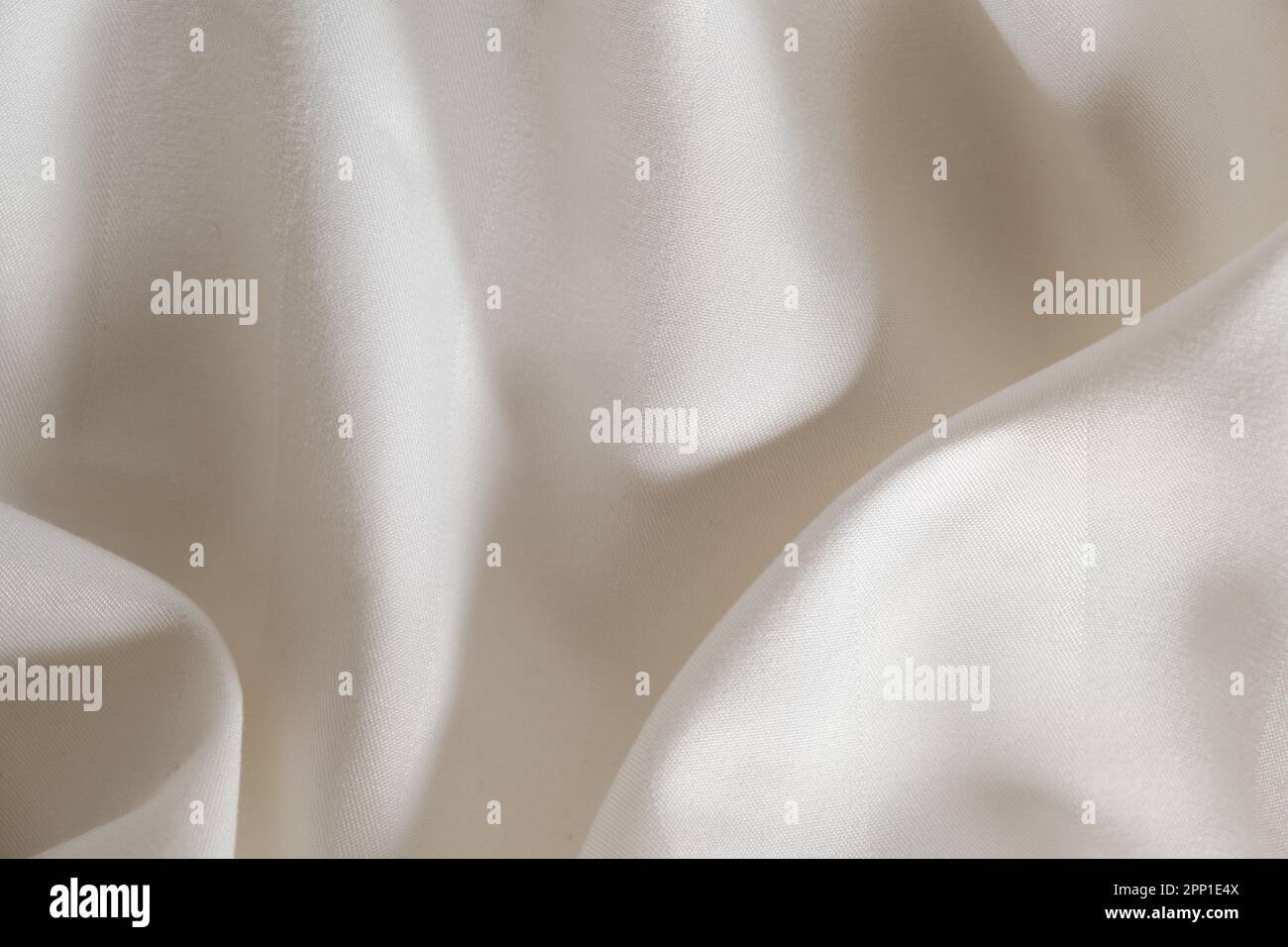 Abstract beige fabric background, satin stripe texture, wavy folds of ...