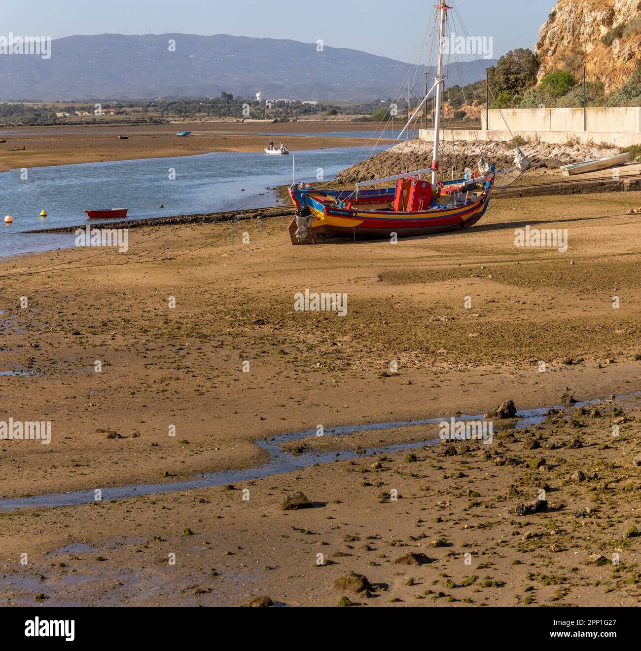 Beautiful Portuguese traditional fishing boat painted yellow, blue and ...