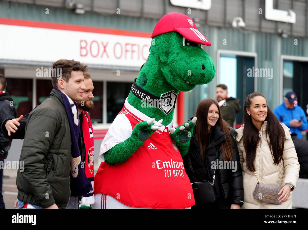 Arsenal club mascot Gunnersaurus poses with fans outside the ground ...