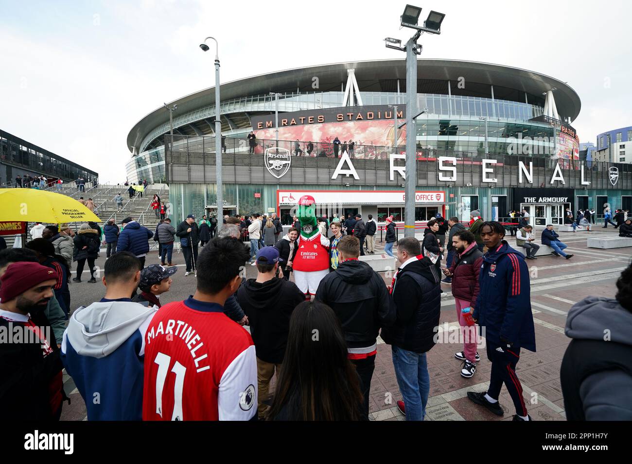 Arsenal club mascot Gunnersaurus poses with fans outside the ground ...