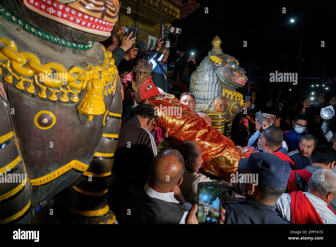 Priests carry Hindu deity Rato Machindranath to be seated inside a 15 ...