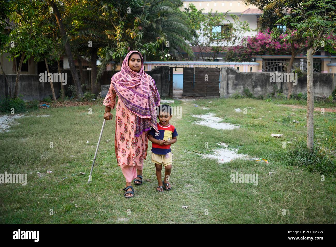 Rana Plaza collapse survivor Yanur Akhter poses for a portrait with her ...