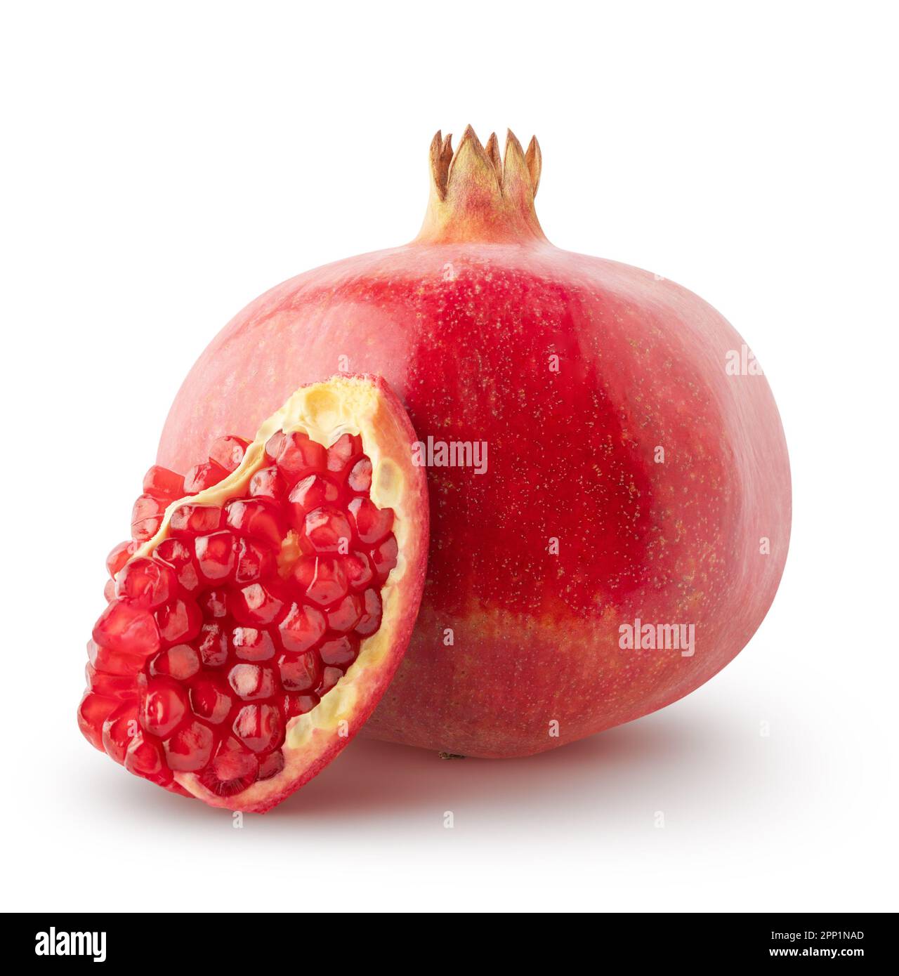 Isolated pomegranate. Whole pomegranate fruit with a piece isolated on ...