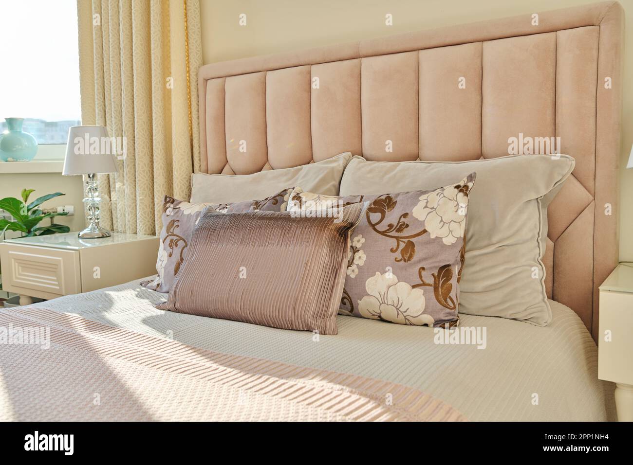 Classic bedroom interior in light ivory colors, in warm sunlight Stock ...