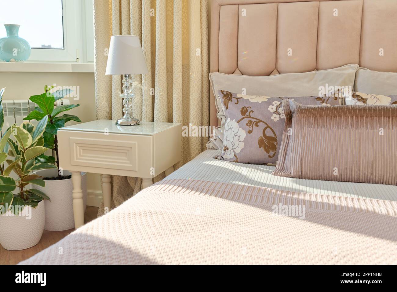 Classic bedroom interior in light ivory colors, in warm sunlight Stock ...