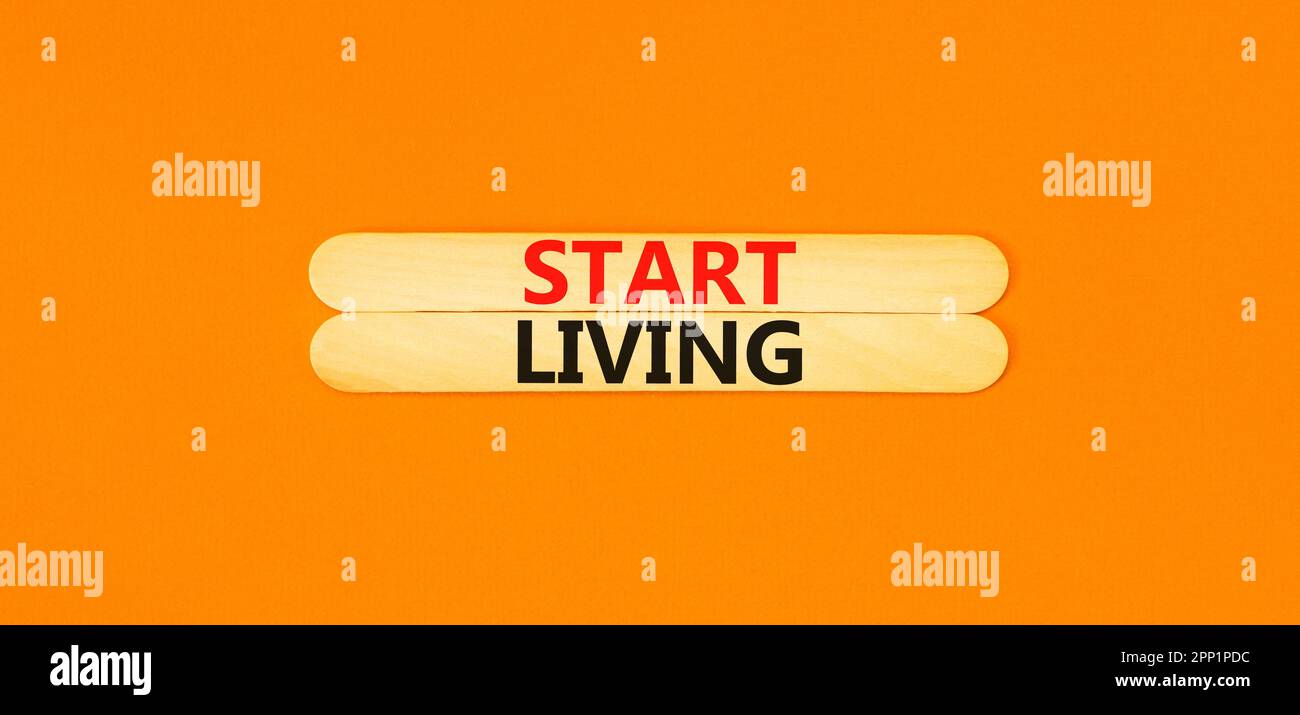 Start living symbol. Concept words Start living on beautiful wooden ...