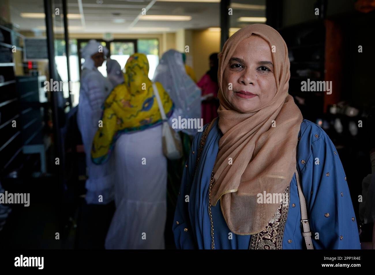 Fatima pauses for a photograph as she gathers with other women to pray ...