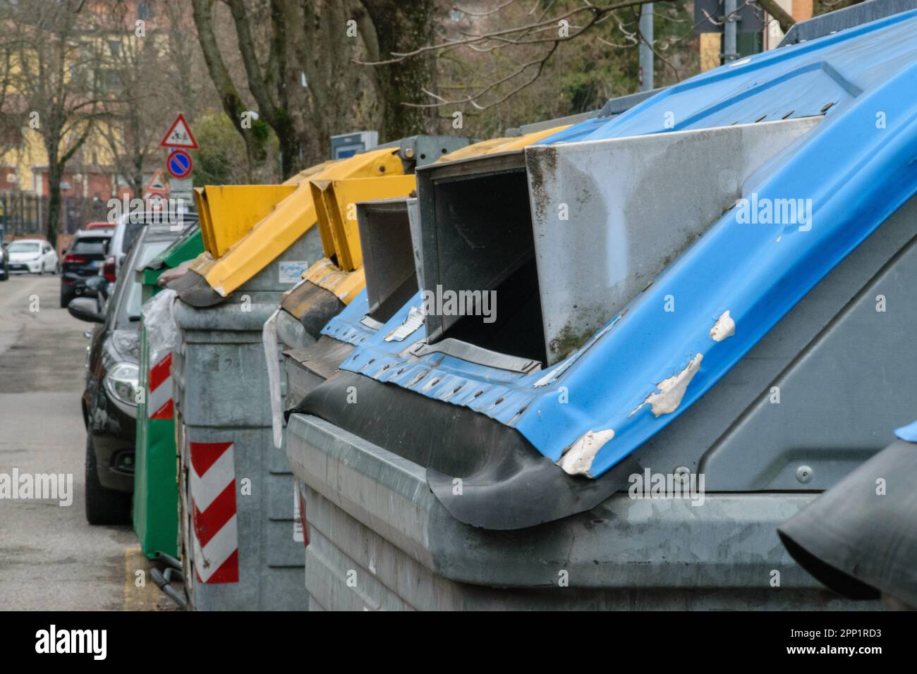 Recycling trash containers lined on the street Stock Photo - Alamy