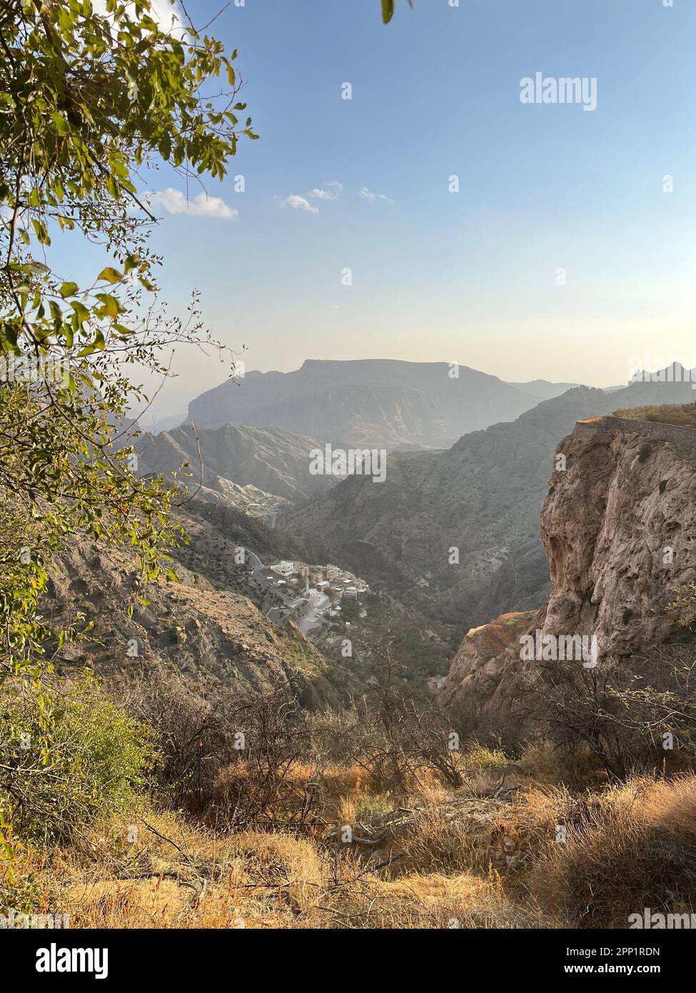 An aerial view of a majestic mountain range, featuring a desolate ...