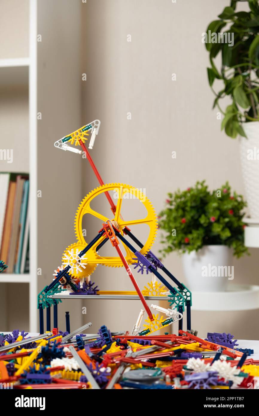 Children's constructor of gears cogwheel and sticks in the children's ...