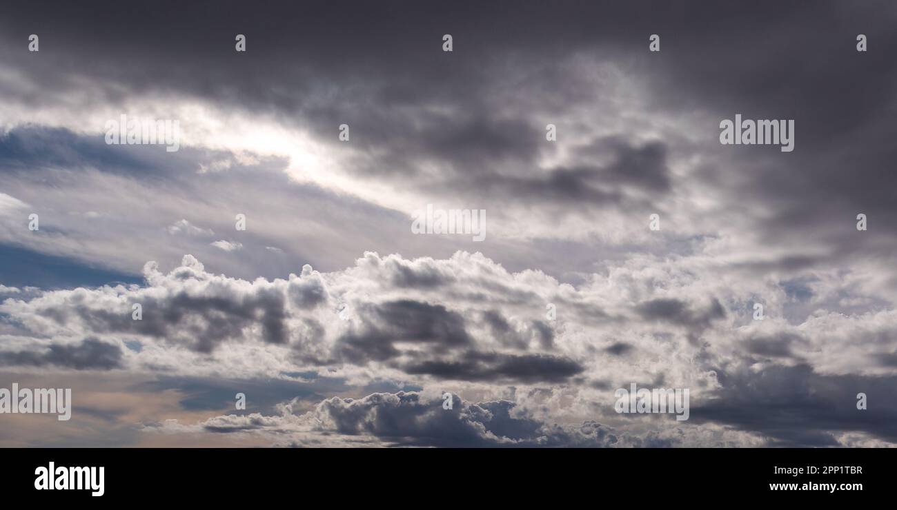 Gray cumulus clouds in the sky. Dramatic skies, landscape. The sky is ...