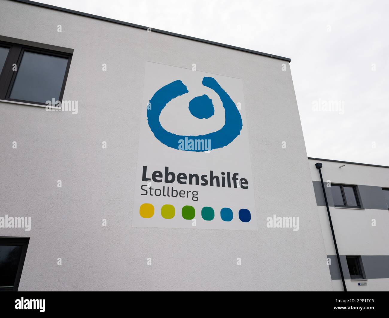 Lebenshilfe (counselling centre) logo on a building facade. The ...