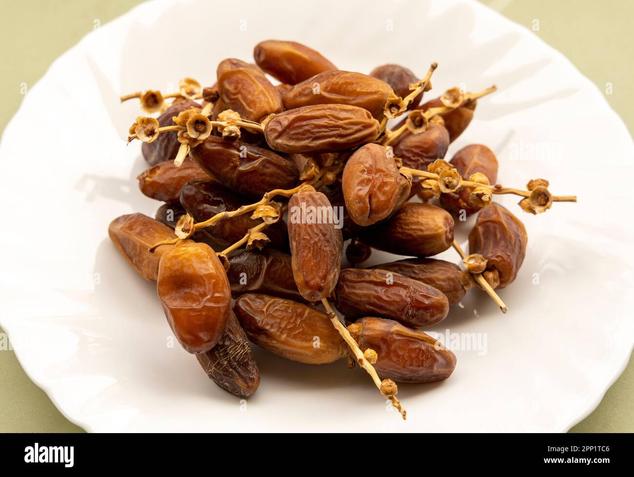 Dates or dattes palm fruit in white bowl is snack healthy, Set of ...