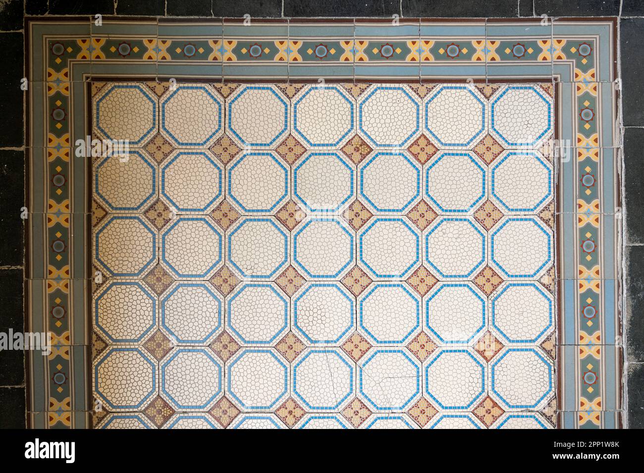 Historical floor tiles in a symmetric pattern of an old house. Antique ...