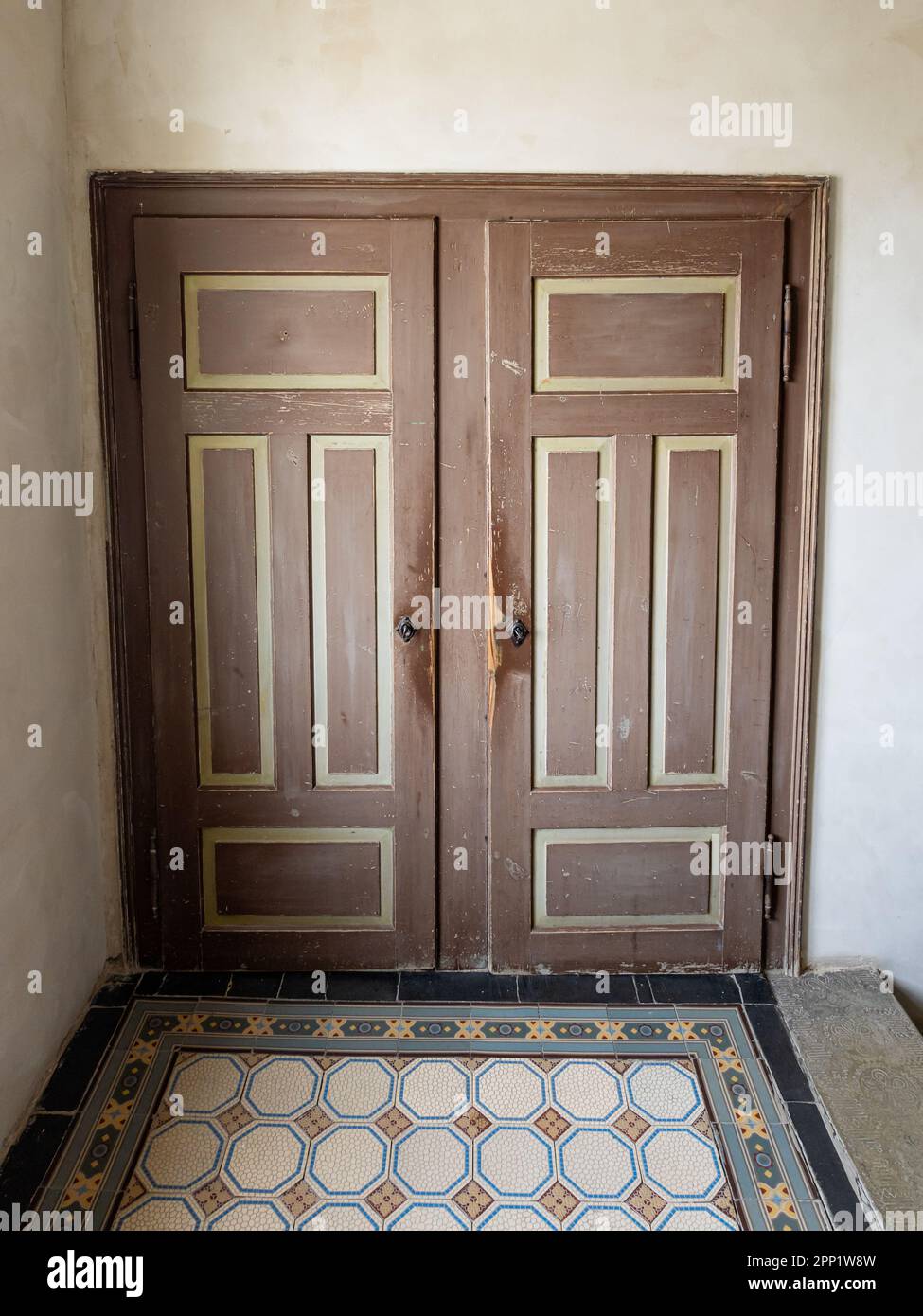Old wooden doors in an old house from 1900. Rough surfaces of the ...