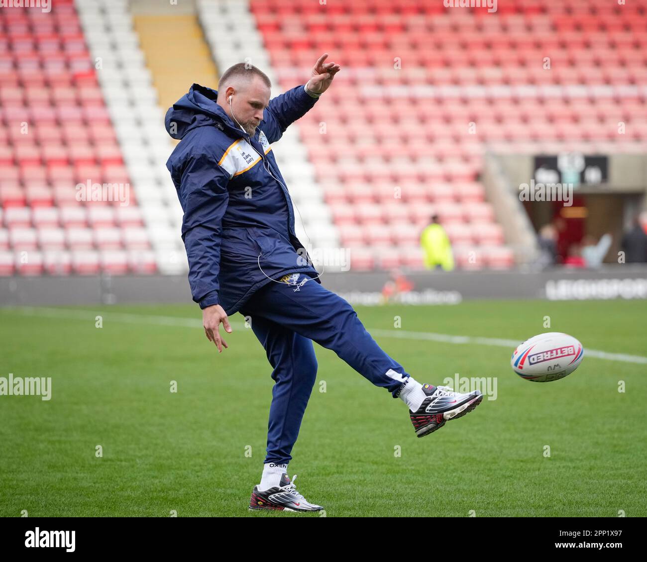 Blake Austin #6 of Leeds Rhinos kicks a ball as he inspects the pitch ...