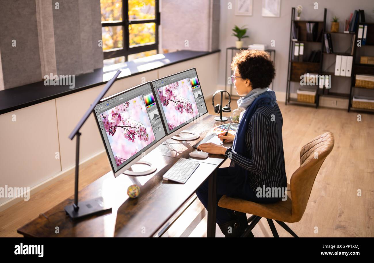 Graphic Designer Artist Working On Multiple Computer Screens Stock Photo - Alamy
