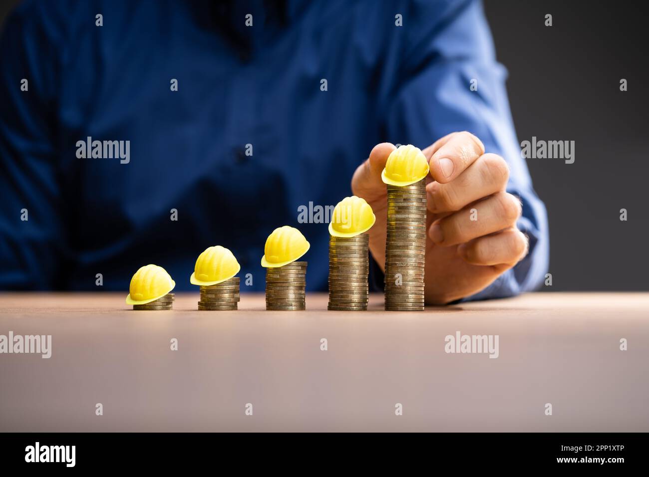 Construction Insurance And Budget Inflation. Coin And Hard Hat Stock ...