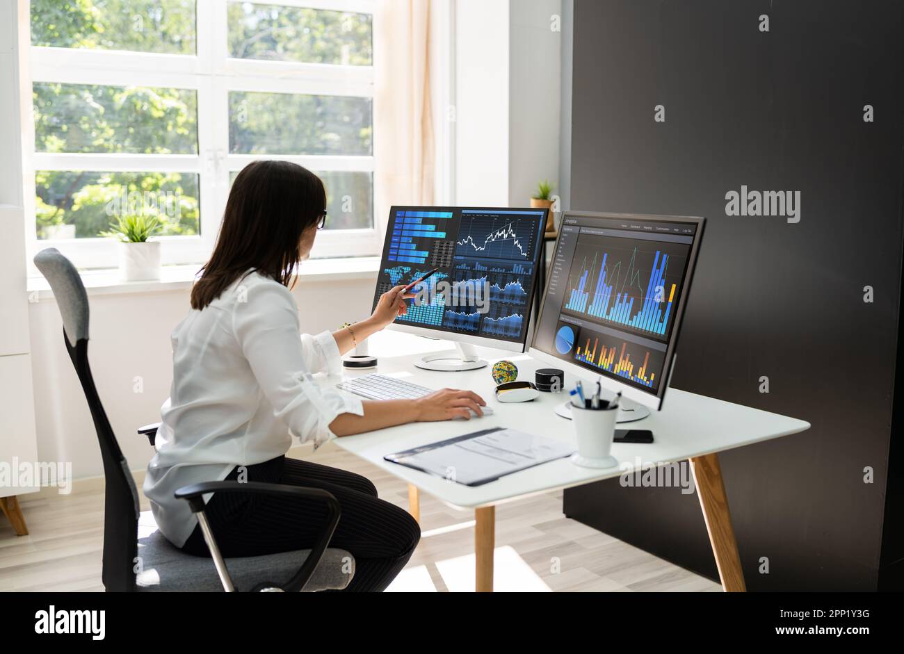 Analyst Women Looking At KPI Data On Computer Screen Stock Photo - Alamy