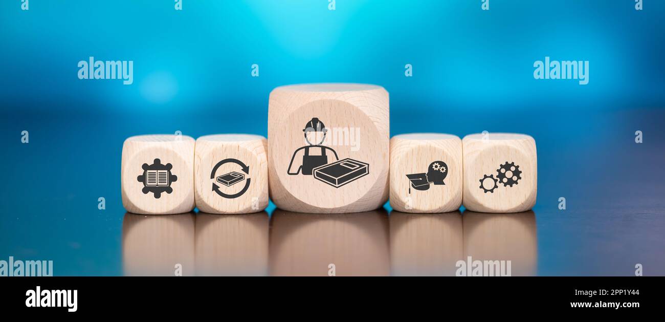 Wooden blocks with symbol of continuing education concept on blue ...