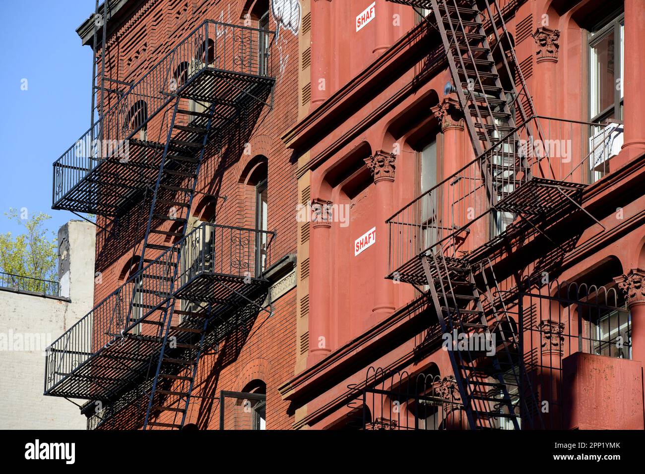 USA, New York City, red old brick building with fire escape Stock Photo ...