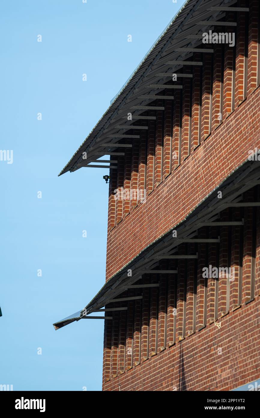 Permanent sun shade outside office windows Stock Photo - Alamy