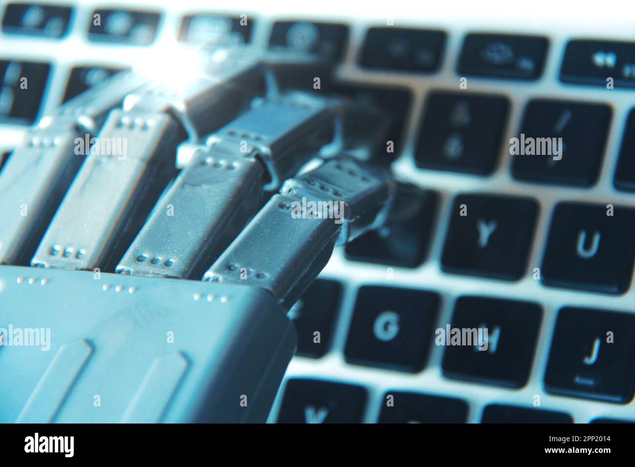 Robotic hand typing on a keyboard . Concept of future and AI Stock ...