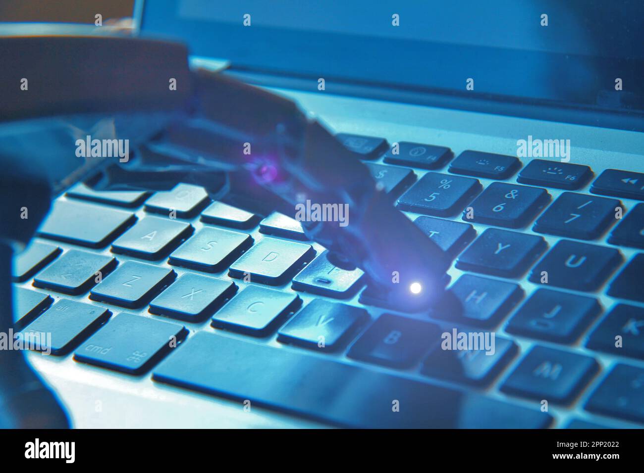 Robotic hand typing on a keyboard . Concept of future and AI Stock ...