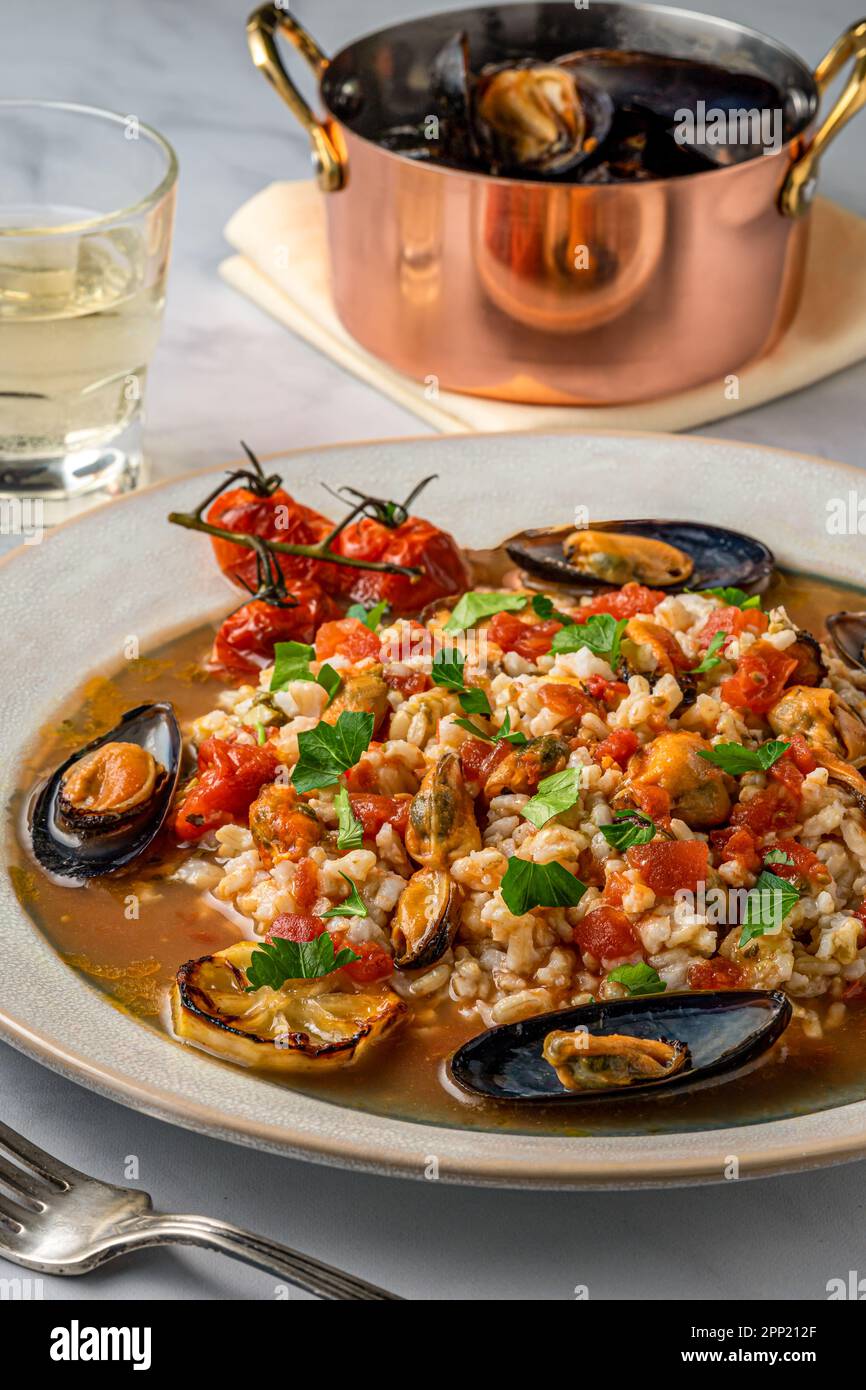 Mussels risotto with garlic and tomatoes. Above shot Stock Photo - Alamy