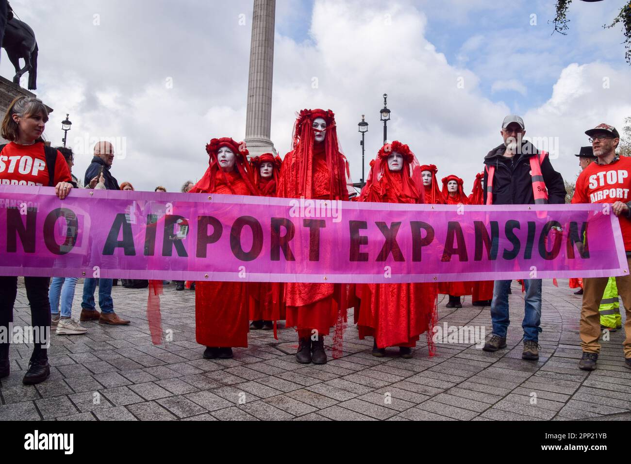 London, UK. 21st April 2023. Red Rebels pass through Trafalgar Square ...