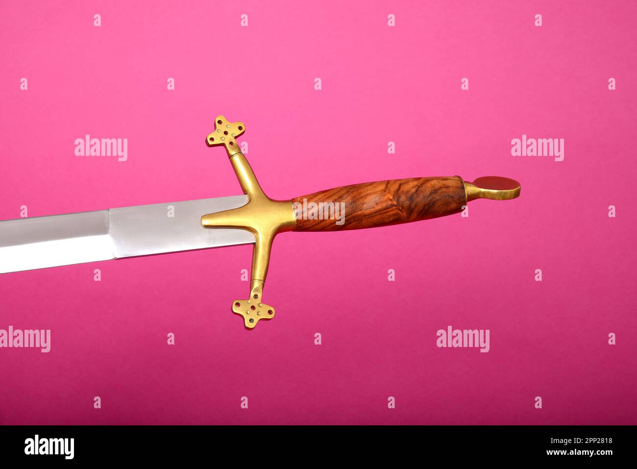 Broadsword blade, guard, and hilt isolated over pink Stock Photo - Alamy
