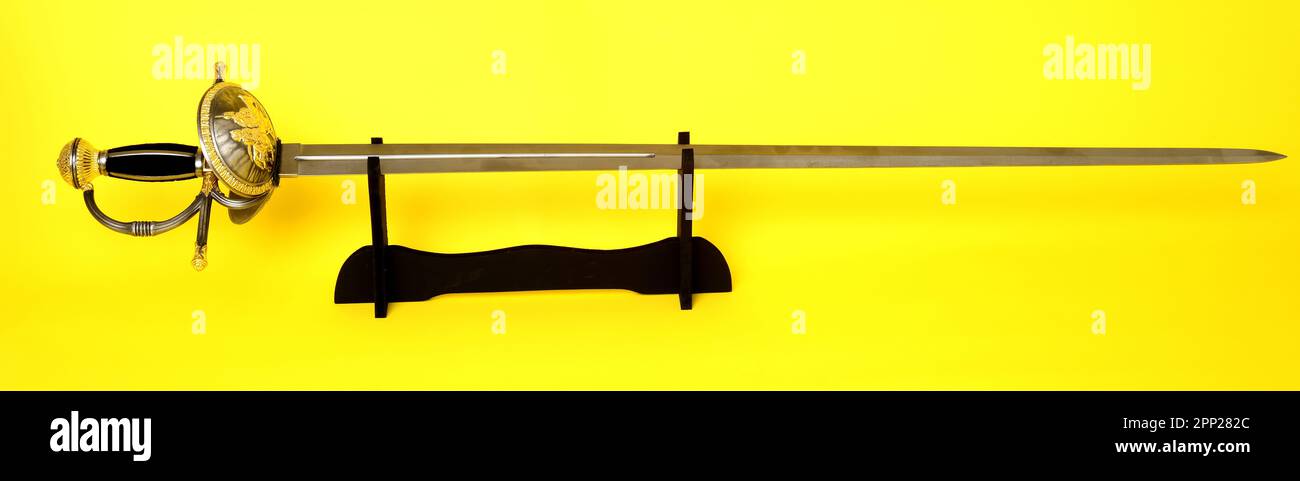 Rapier sword, guard, and hilt isolated over yellow Stock Photo - Alamy
