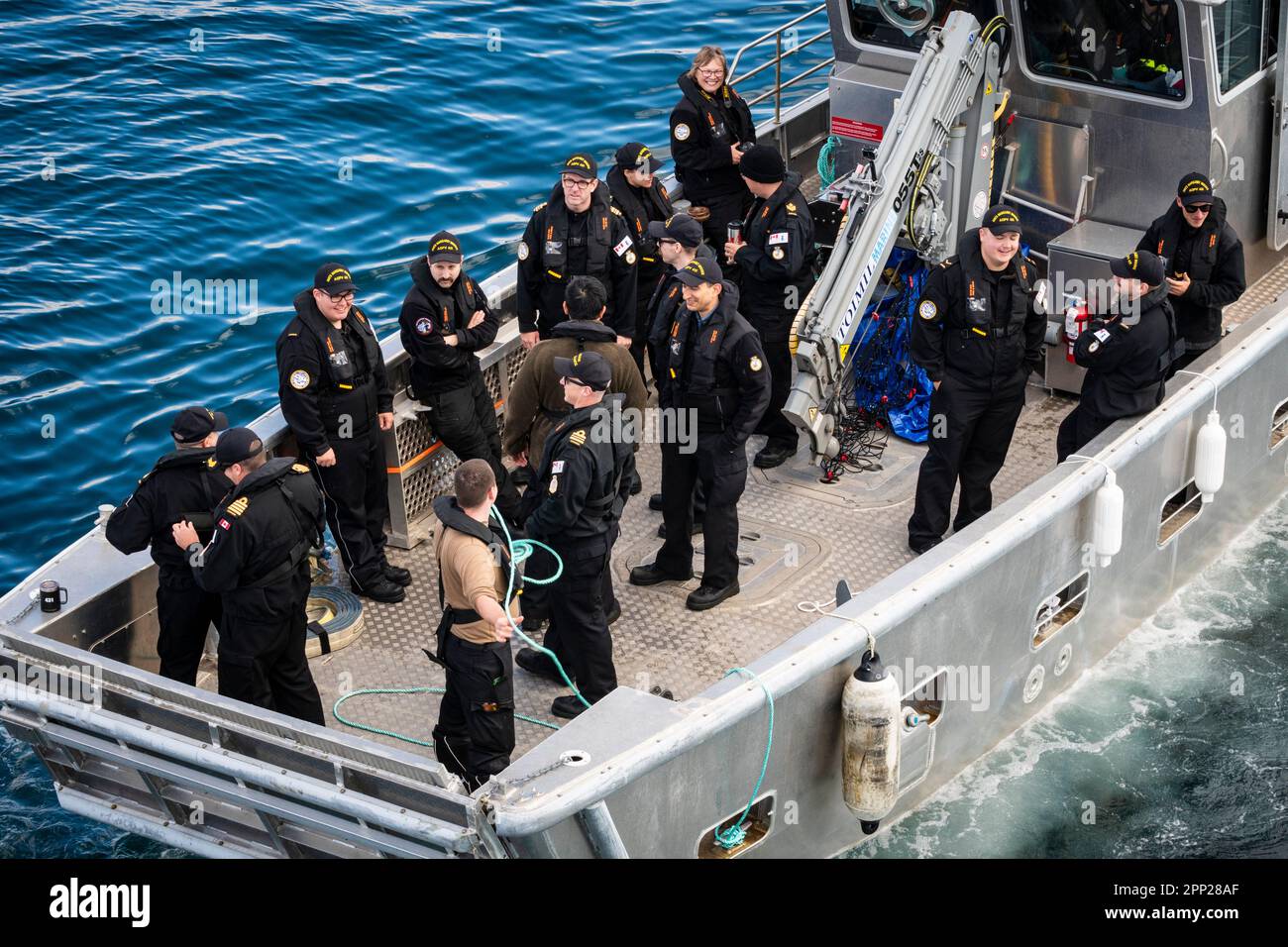 Landing craft embarked in HMCS Margaret Brooke transfers crew ashore at ...