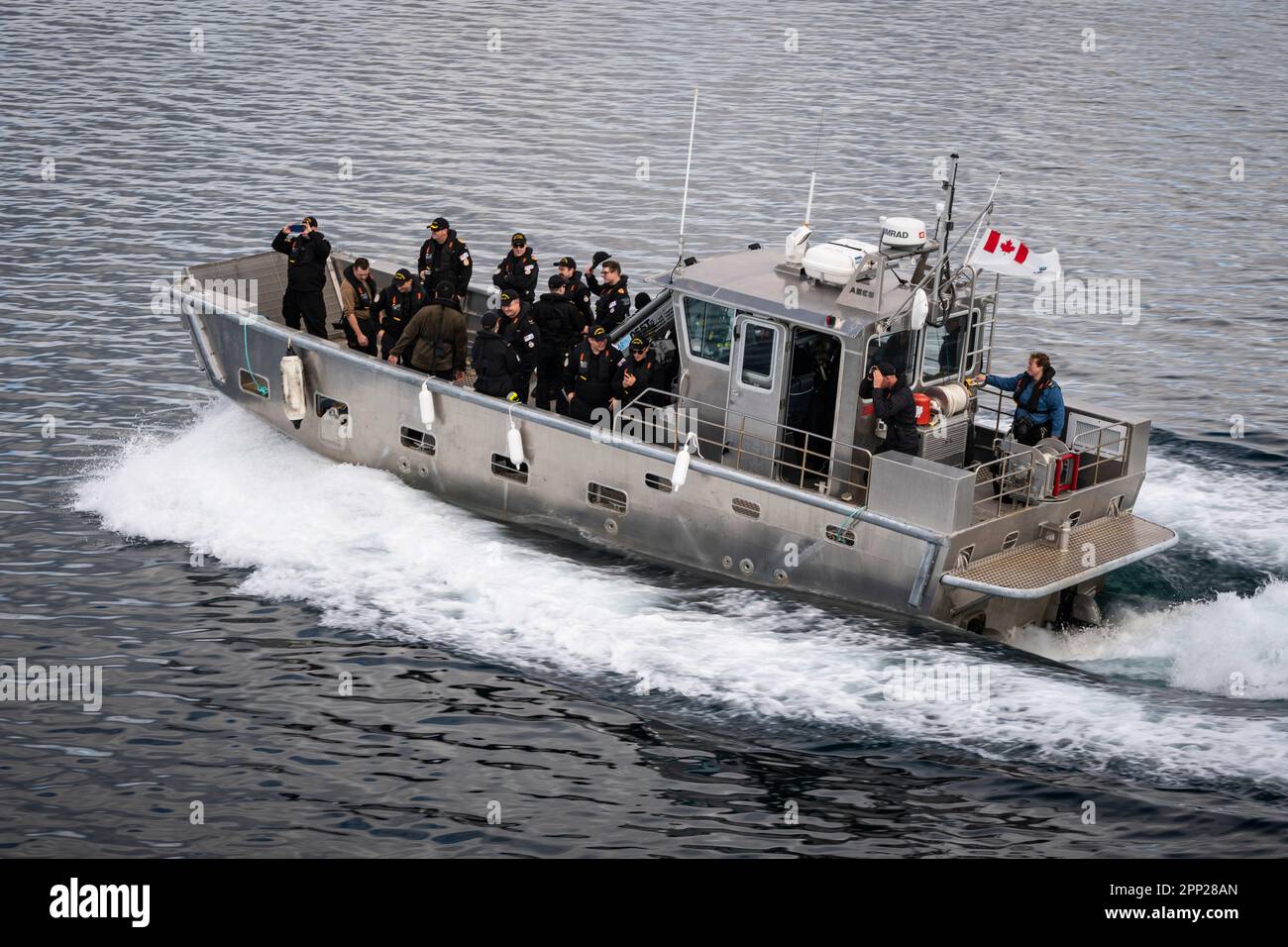 Landing craft embarked in HMCS Margaret Brooke transfers crew ashore at ...