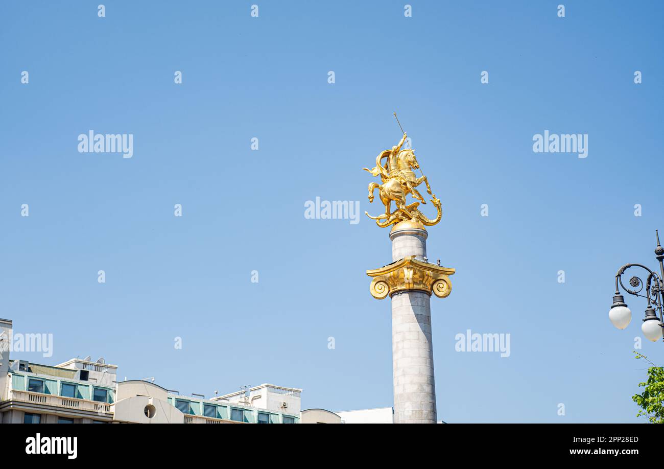 Golden statue of St. George on Freedom square of Tbilisi, capital city ...