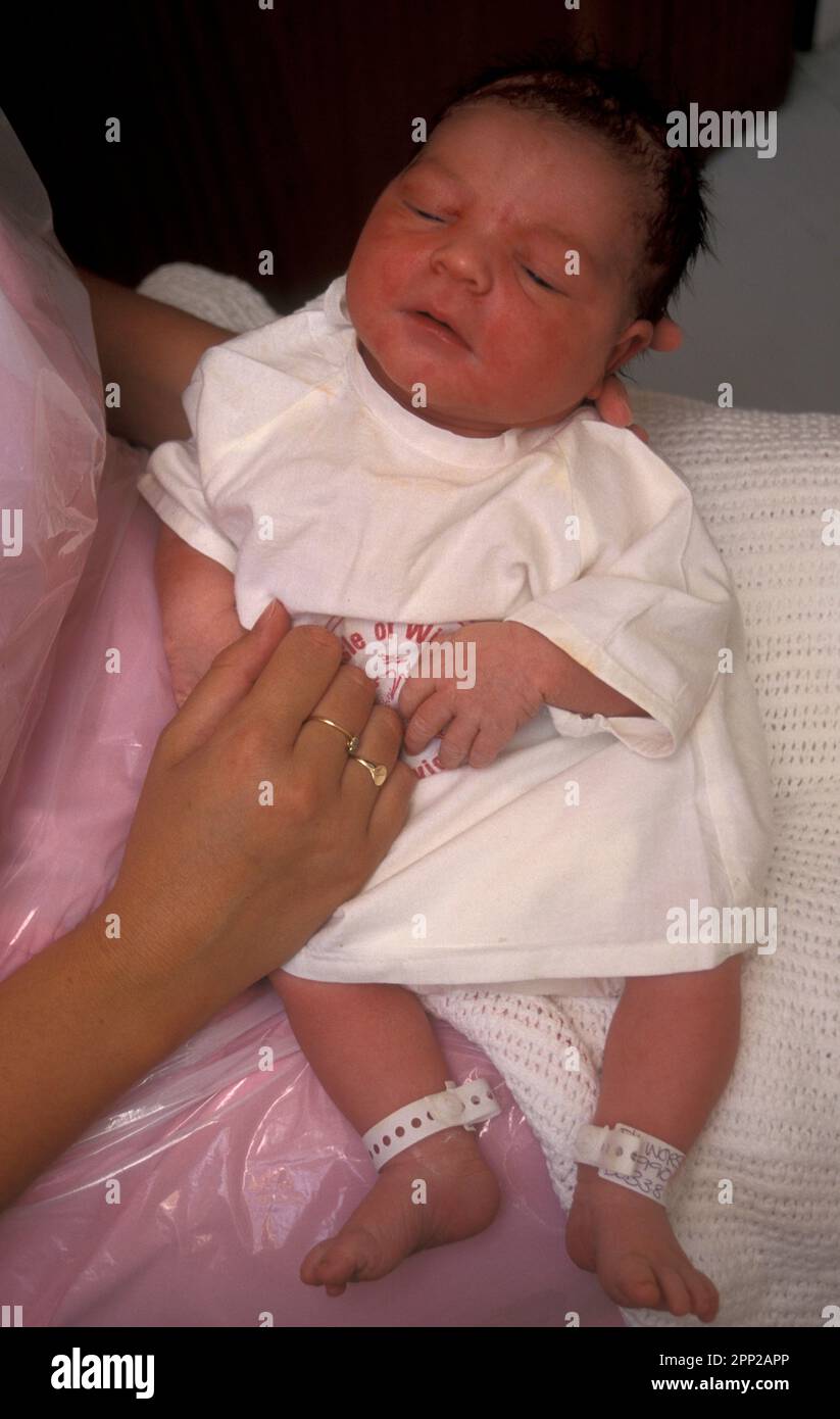 nurse holding newborn baby born by cesarian section Stock Photo - Alamy