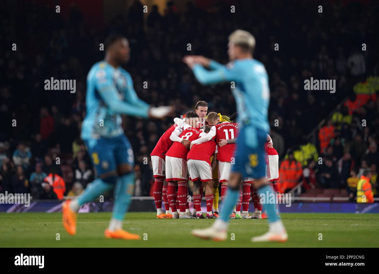 Arsenal players in a group huddle before the second half during the ...
