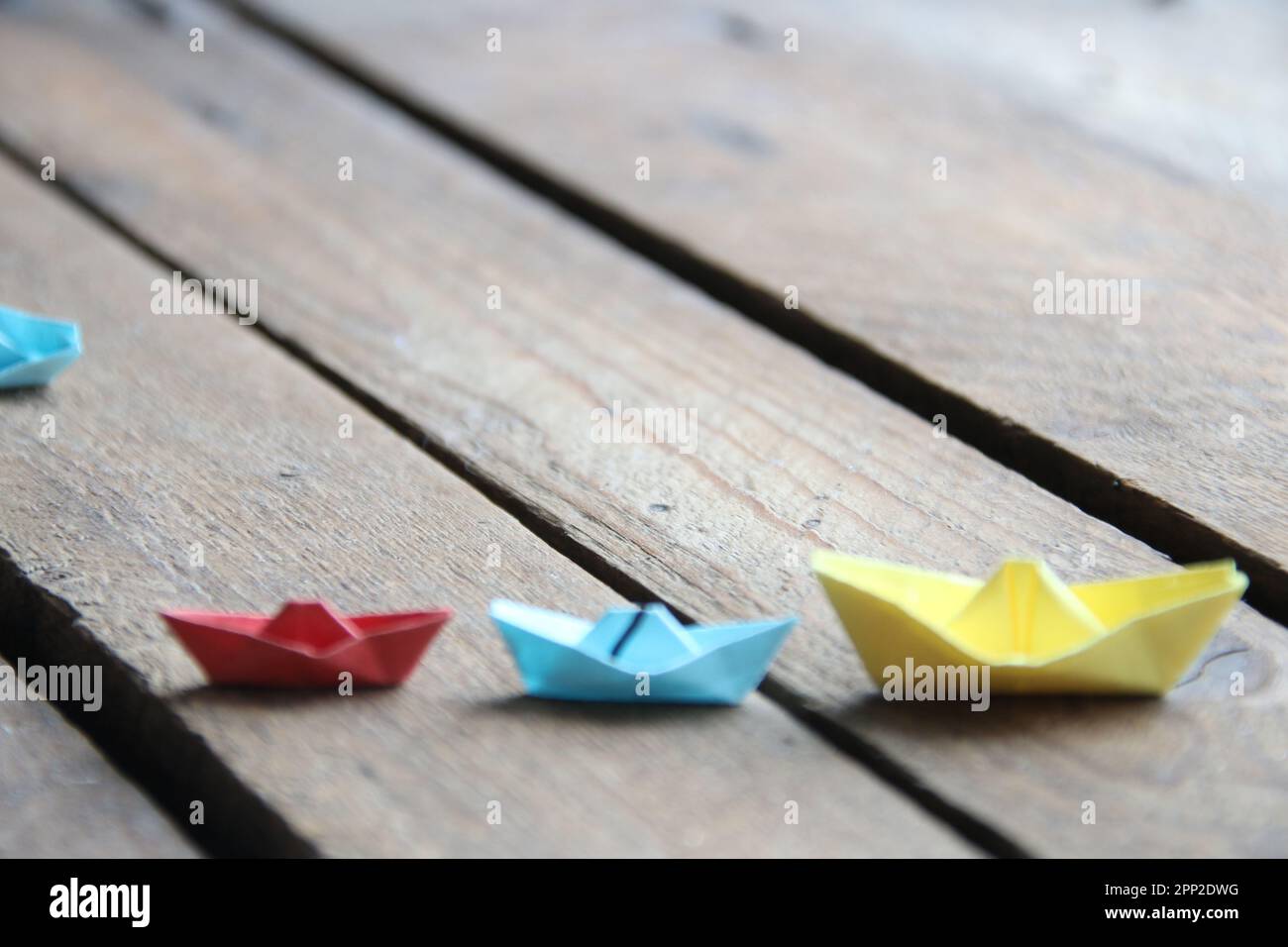 leadership idea. Paper boats on vintage background Stock Photo - Alamy